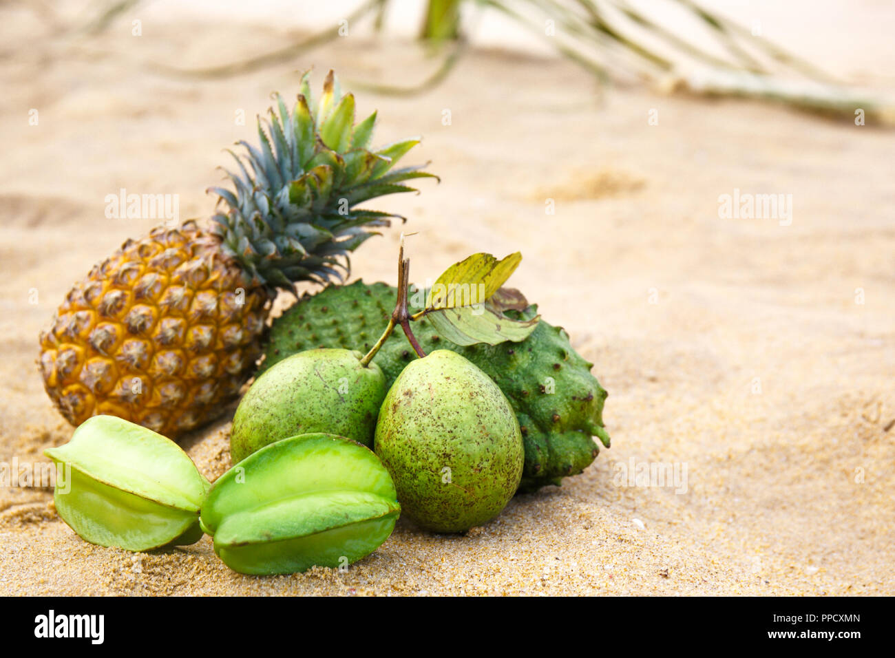 Exotic fruits on the sand near the ocean Stock Photo - Alamy