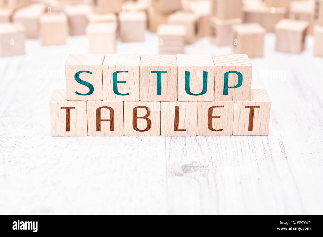 The Words Setup Tablet Formed By Wooden Blocks On A White Table Stock ...