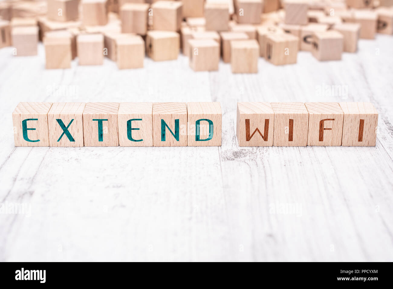 The Words Extend WIFI Formed By Wooden Blocks On A White Table Stock ...