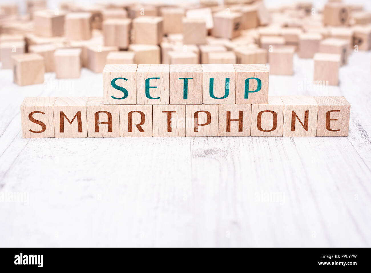 The Words Setup Smartphone Formed By Wooden Blocks On A White Table ...