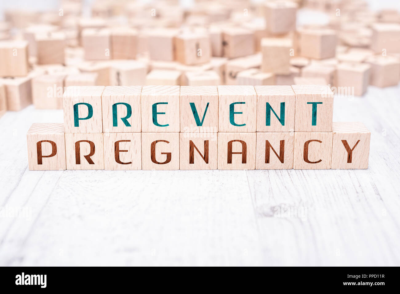 The Words Prevent Pregnancy Formed By Wooden Blocks On A White Table ...