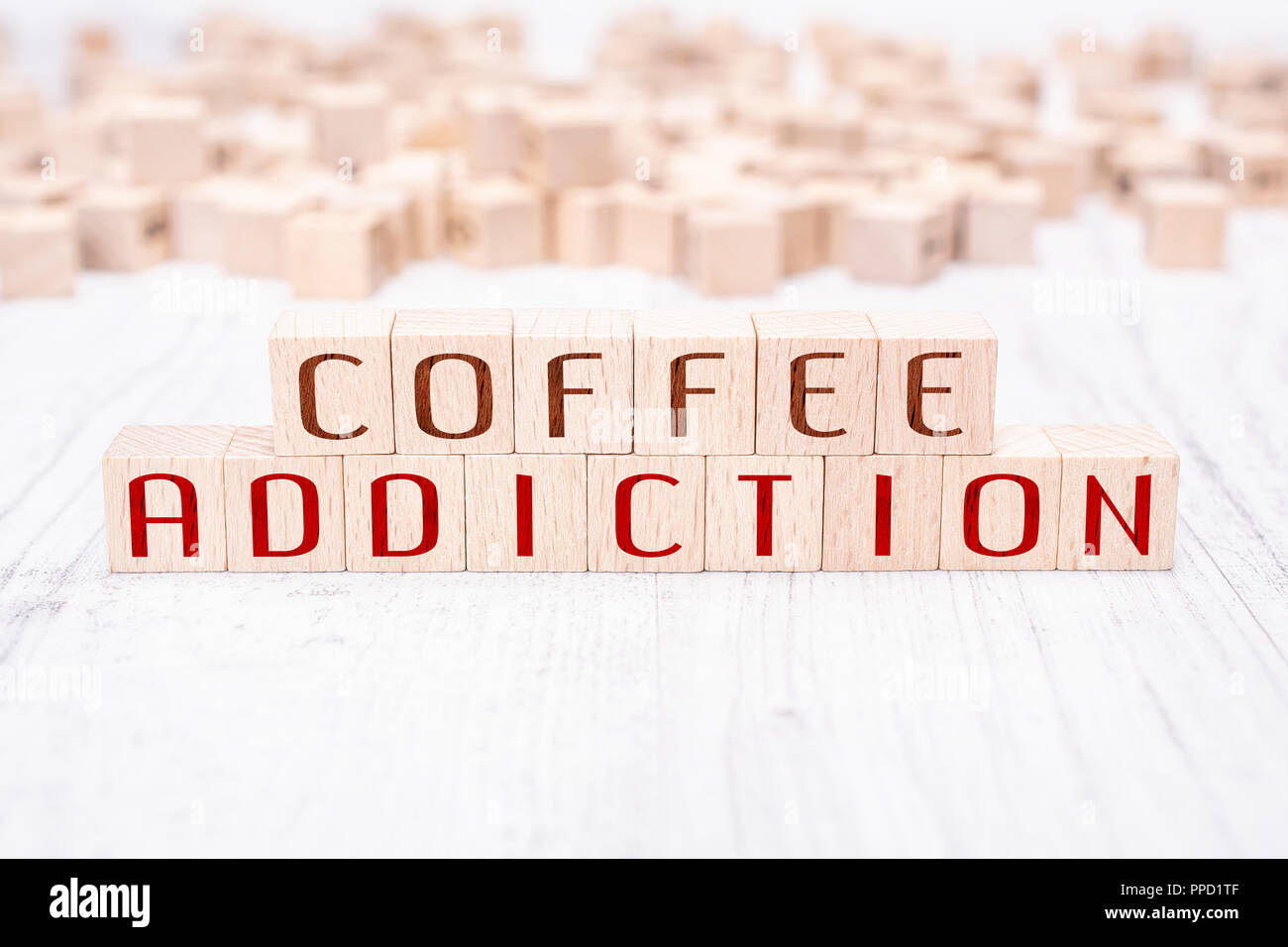 The Words Coffee Addiction Formed By Wooden Blocks On A White Table ...
