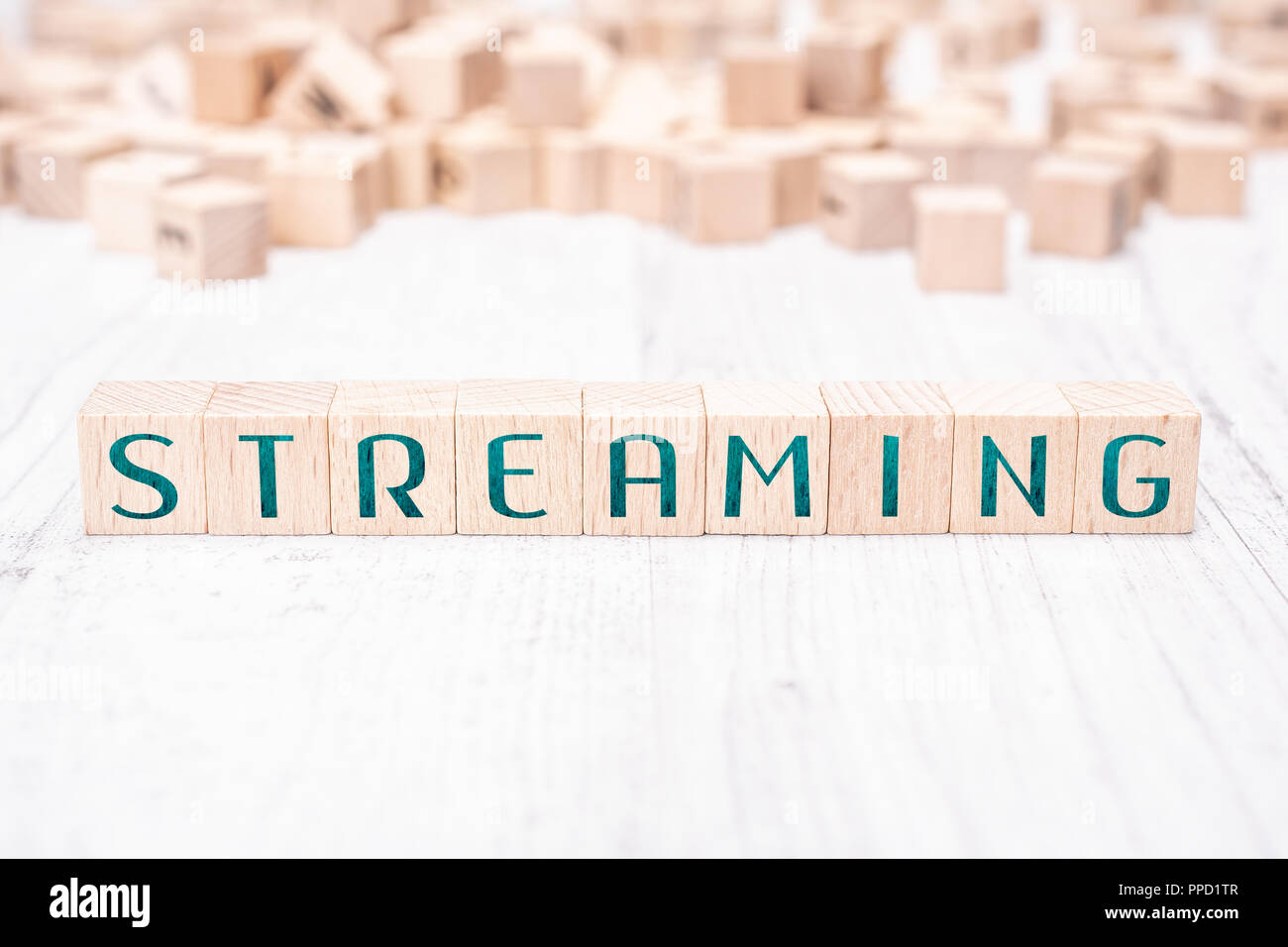The Word Streaming Formed By Wooden Blocks On A White Table Stock Photo ...