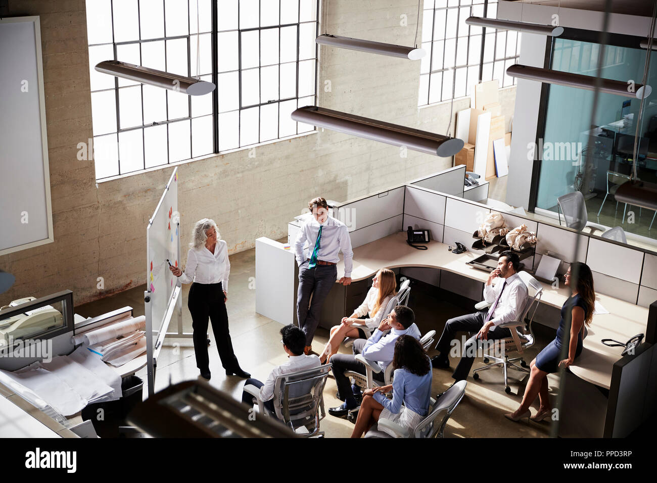 Female manager using whiteboard in a meeting, elevated view Stock Photo ...