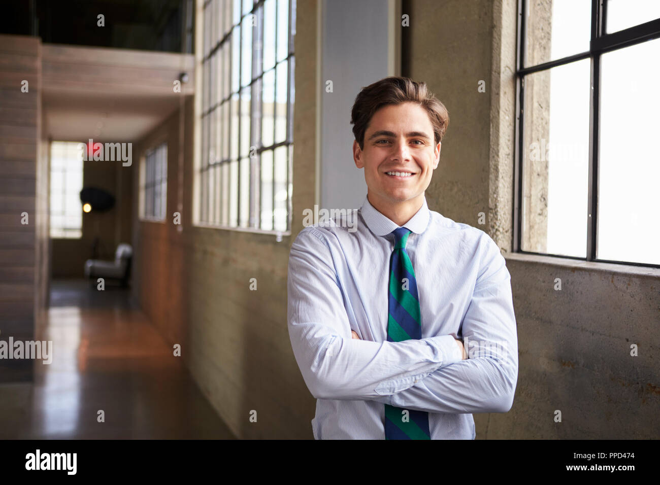 Man arms crossed stands hi-res stock photography and images - Alamy