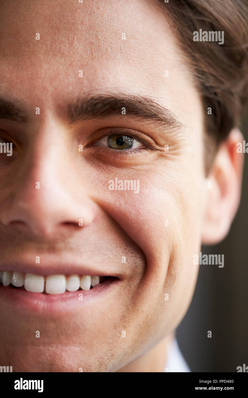 Vertical half of young white man’s face, close up Stock Photo - Alamy