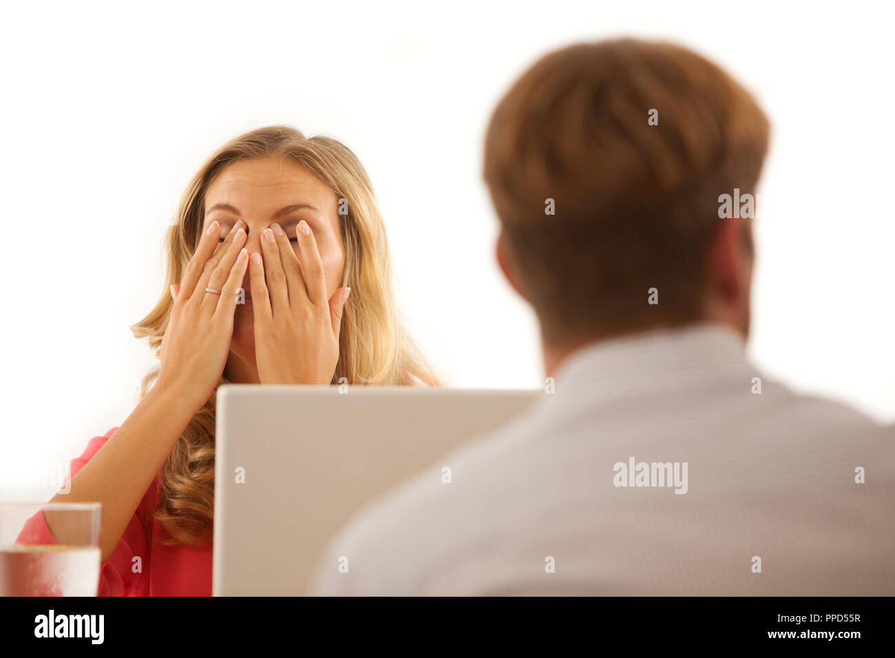 Stressed businesswoman with colleague Stock Photo - Alamy
