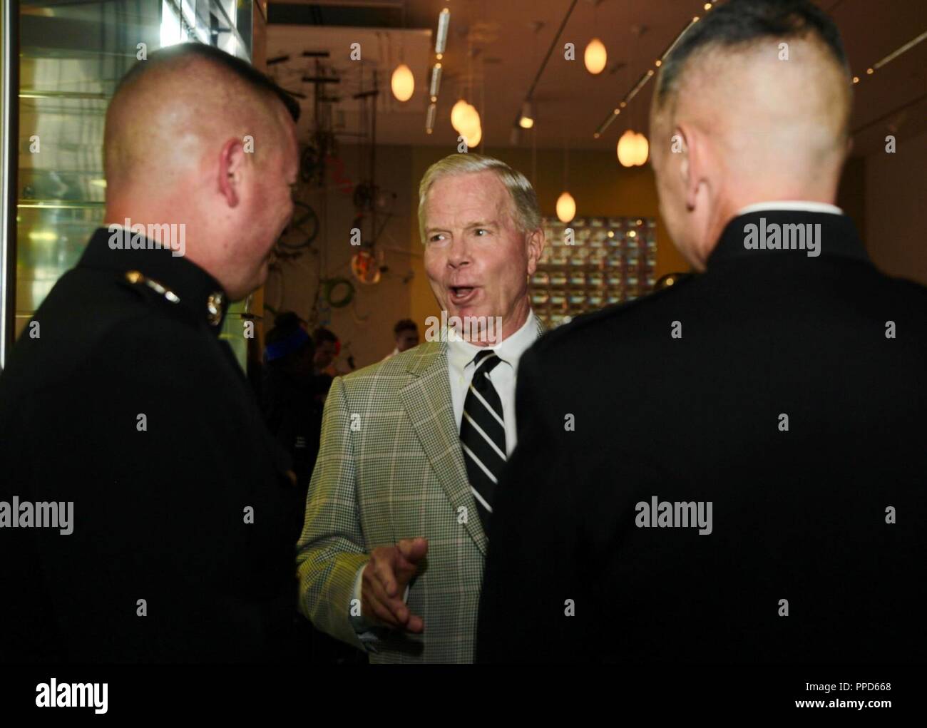 Retired Marine Gen. James Amos speaks with Maj. Gen. James Bierman and ...