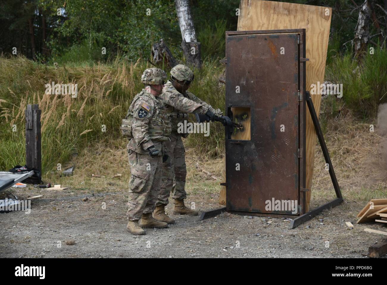 A U.S. Soldier assigned to 2nd Cavalry Regiment uses an M500 shotgun to ...