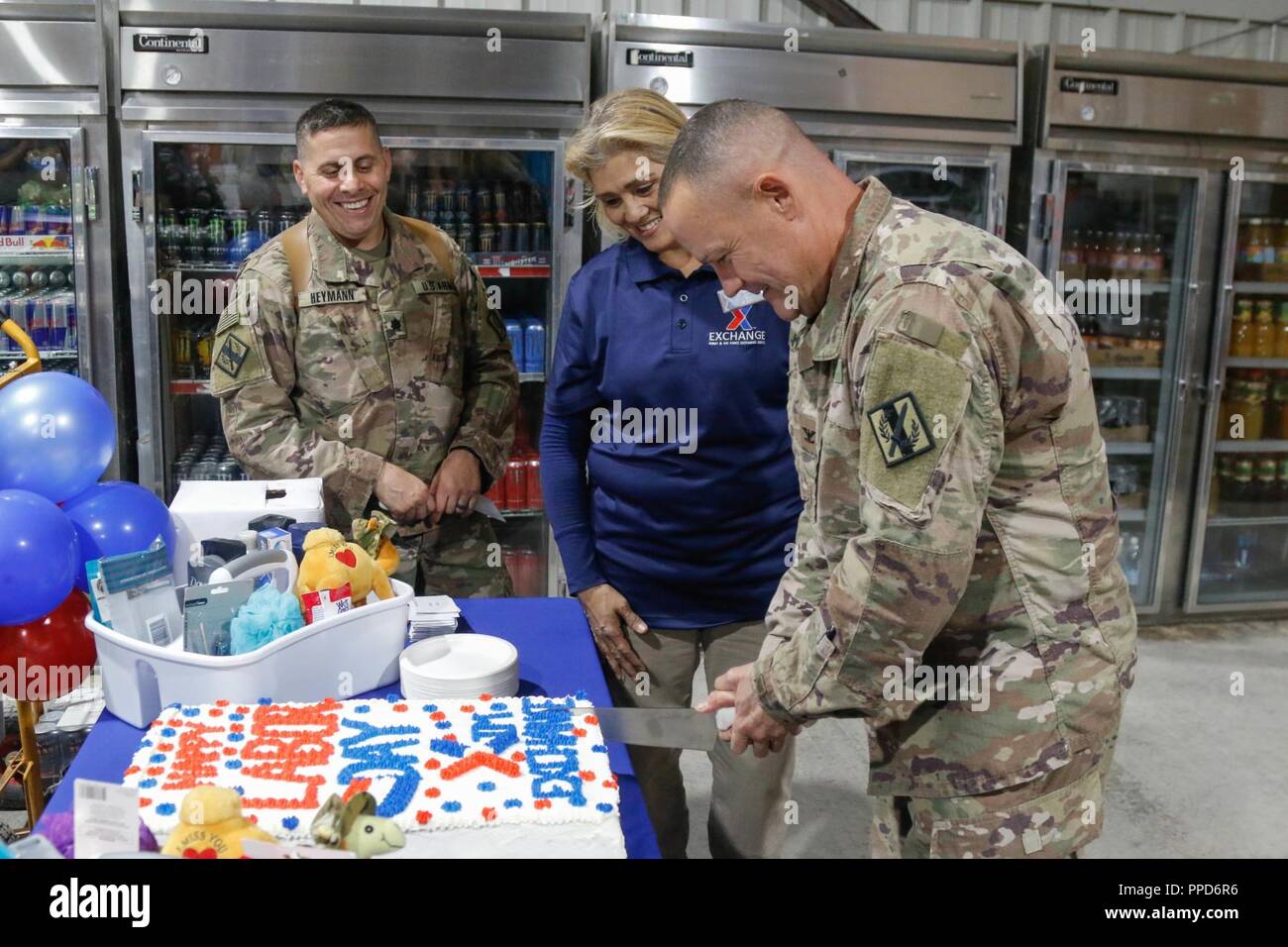U.S. Army Col. Michael Maddox, Al Asad Air Base (AAAB) commander, cuts ...