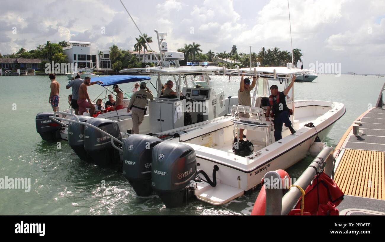 Members of Coast Guard Station Miami and the Miami-Dade Police ...