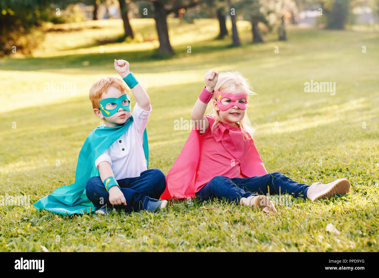 Cute adorable preschool Caucasian children playing superheroes. Two ...