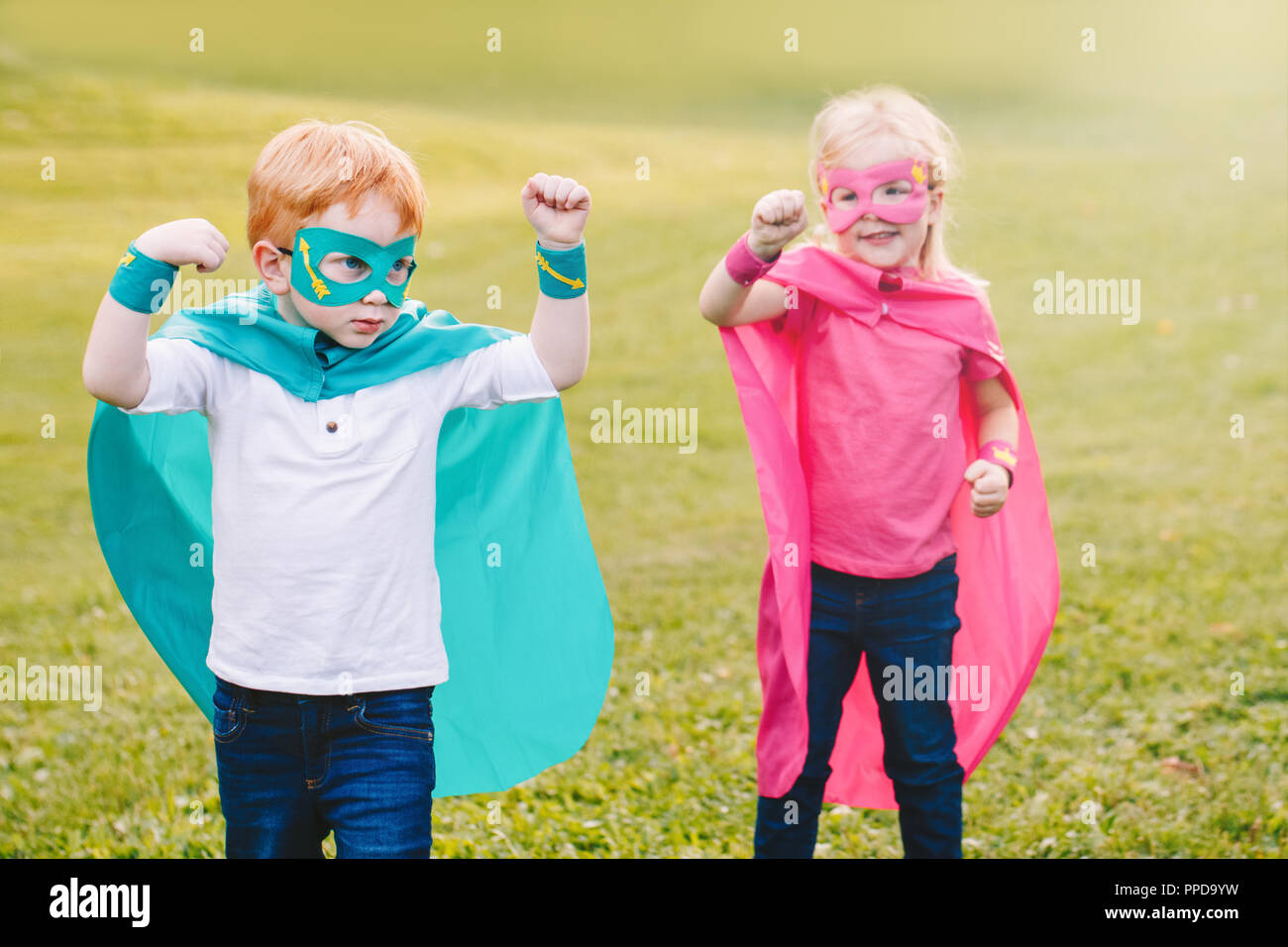 Cute adorable preschool Caucasian children playing superheroes. Two ...