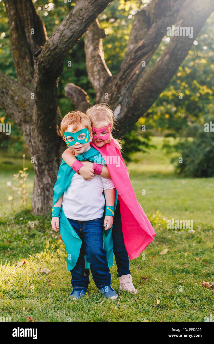 Cute adorable preschool Caucasian children playing superheroes. Two ...