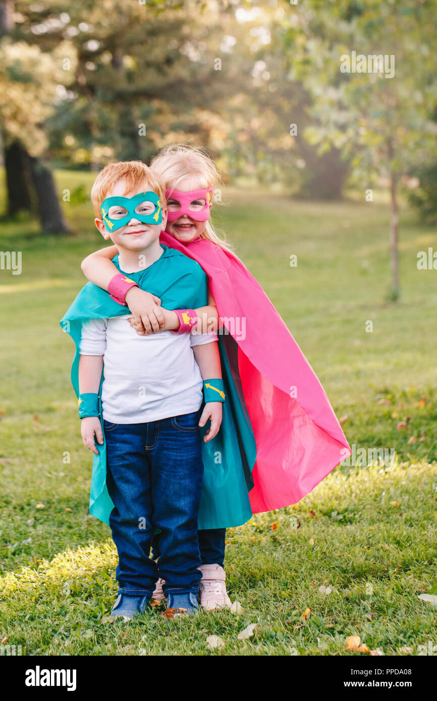 Cute adorable preschool Caucasian children playing superheroes. Two ...