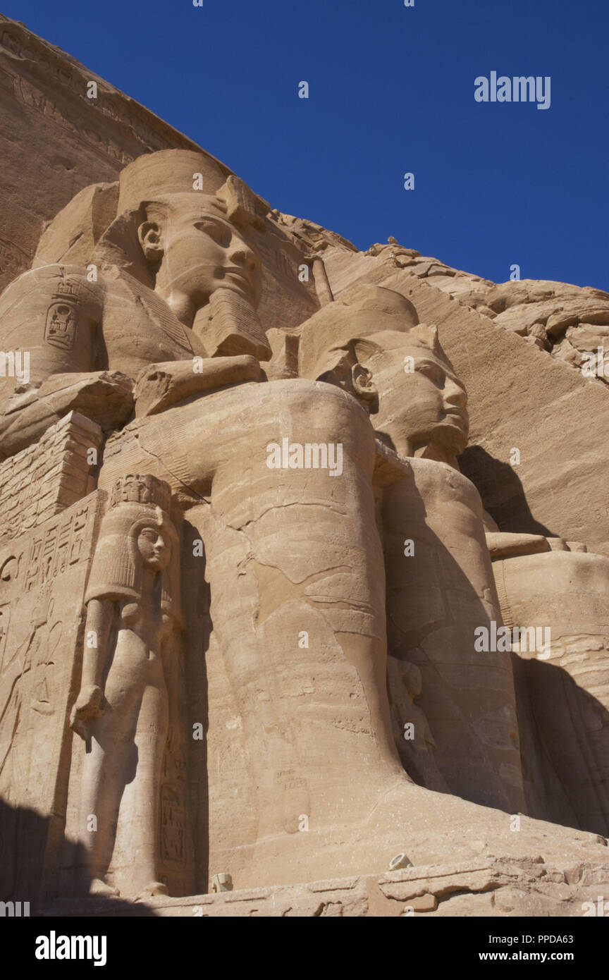 Egyptian art. Great Temple of Ramses II. Two colossal statues depicting ...