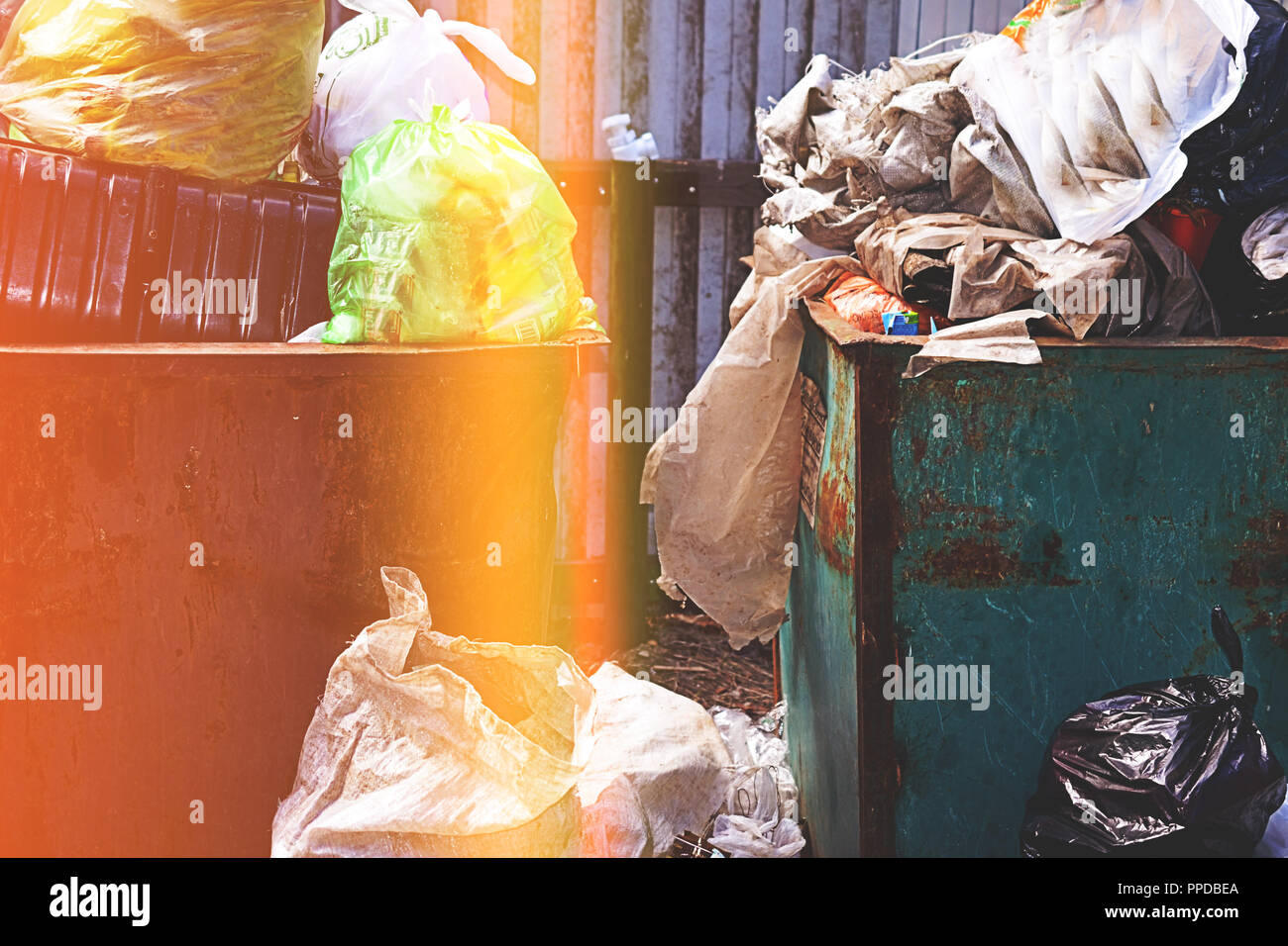 Litter box full of garbage in forest. Concept of ecology problem. Toned ...