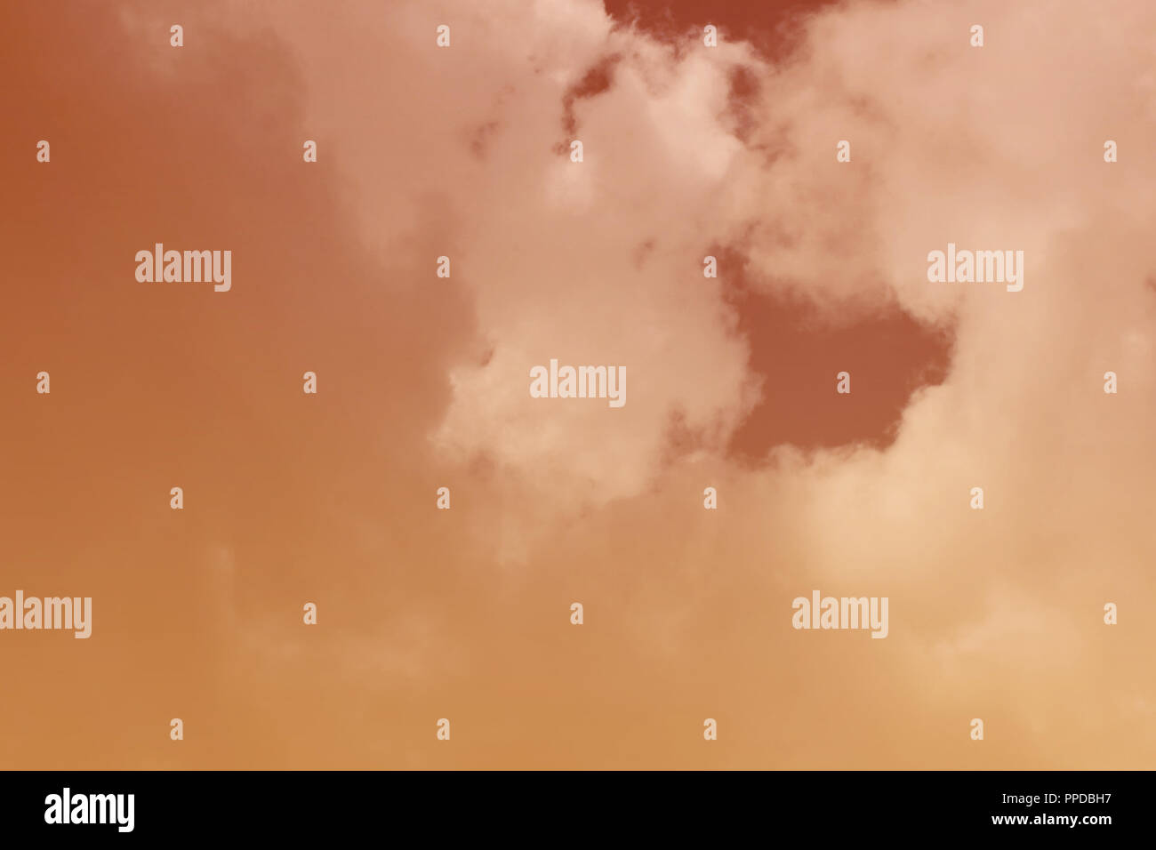 Nature background. Fluffy soft clouds in sky toned Stock Photo - Alamy