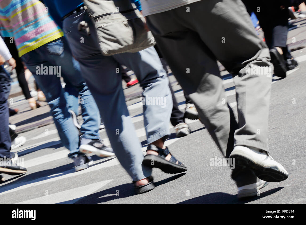 People in motion blur using a crosswalk Stock Photo - Alamy