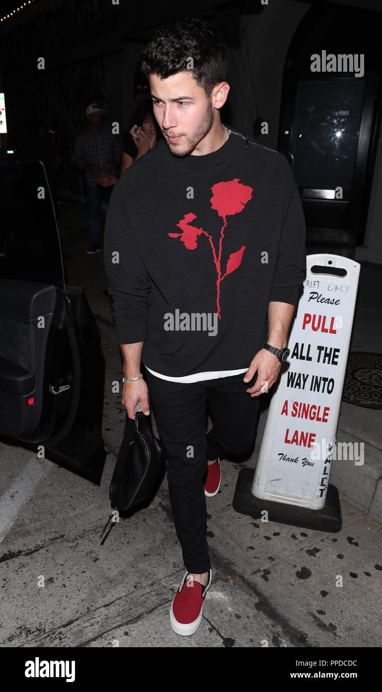 Nick Jonas poses for selfies with fans as he leaves Craig's restaurant ...