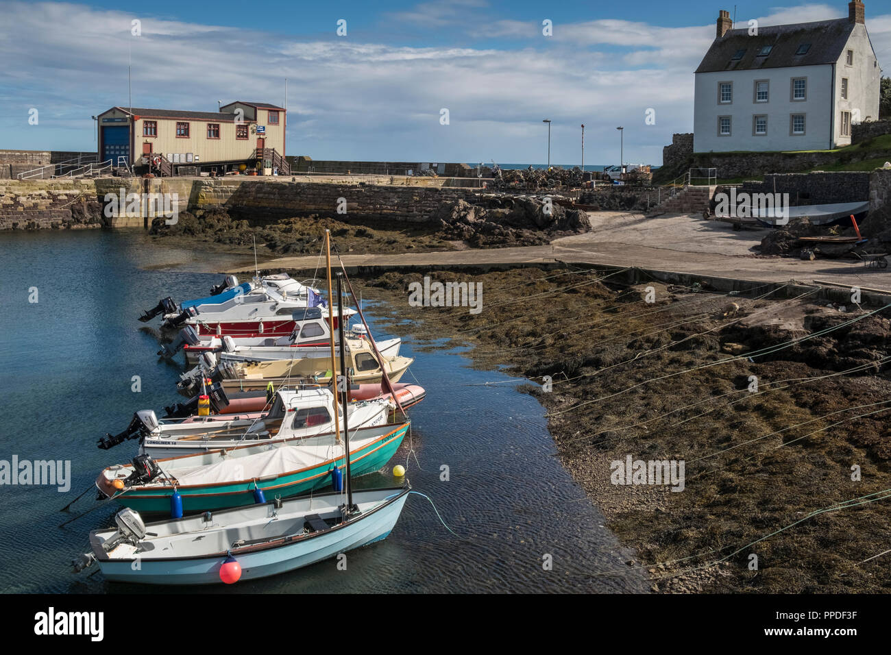 Boats in St Abbs harbour, a small fishing village on the southeast ...