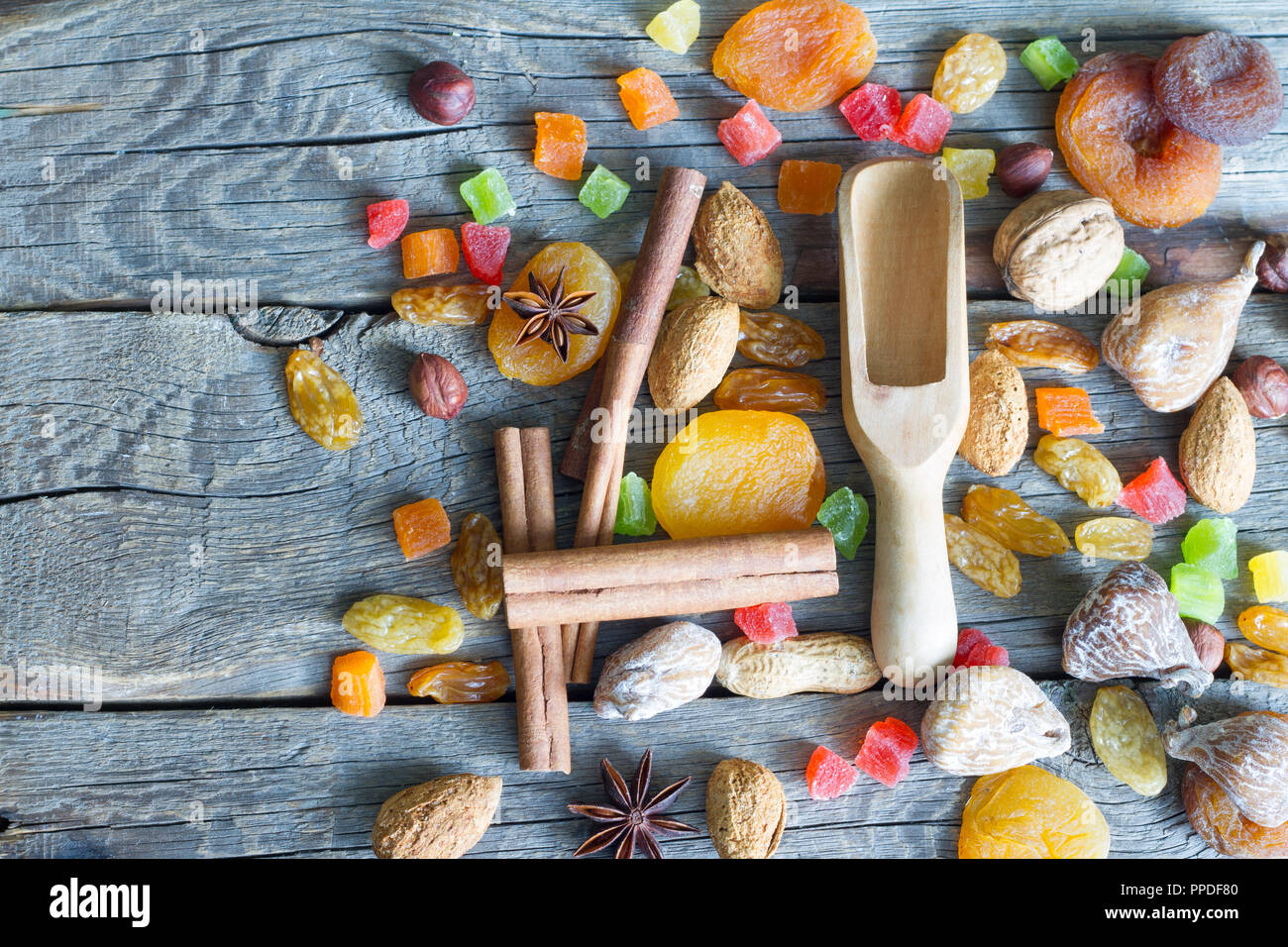 Dried fruits and nuts organic healthy snacks on old planks Stock Photo ...