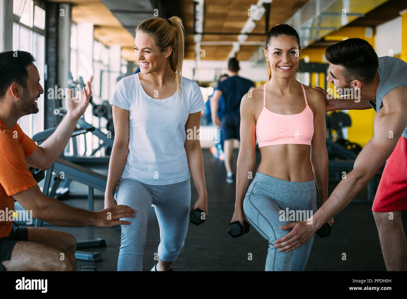 Working out in fitness center Stock Photo - Alamy