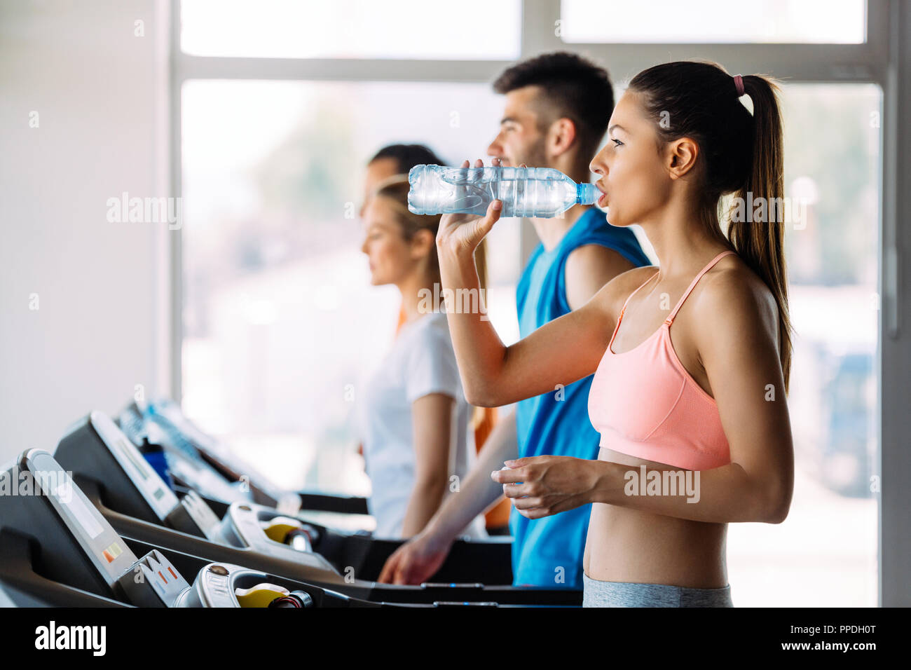 Women Bottled Water While Exercising