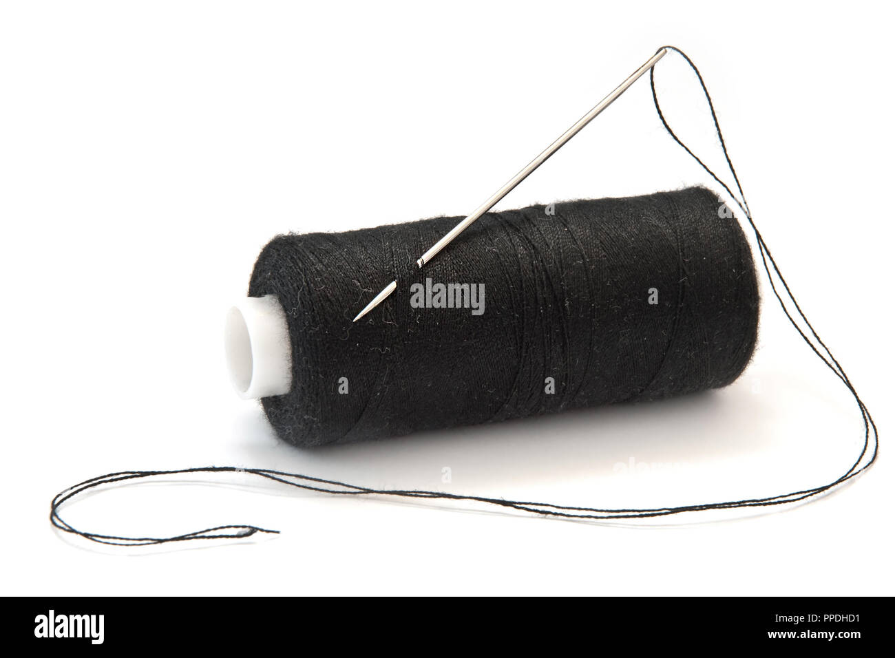 needle and thread isolated on a white background Stock Photo - Alamy
