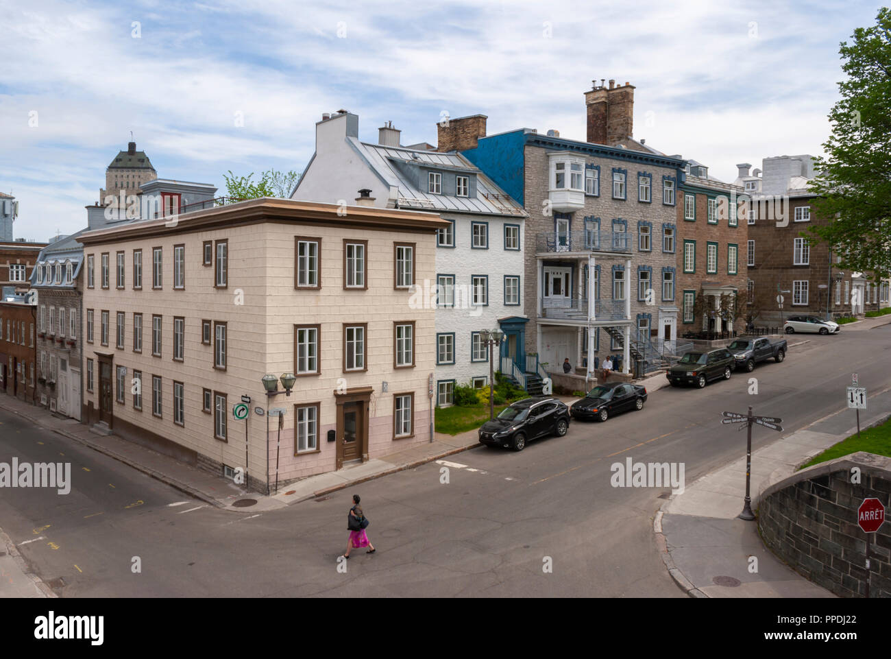 City quarter in Old Quebec with stone townhouses lining a street corner ...
