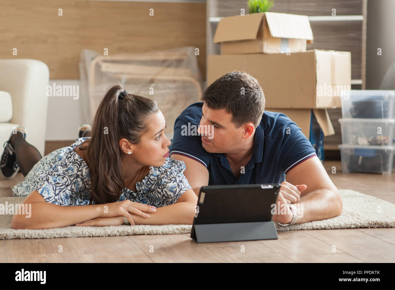 Wife and husband looking after things to buy for their new flat Stock ...