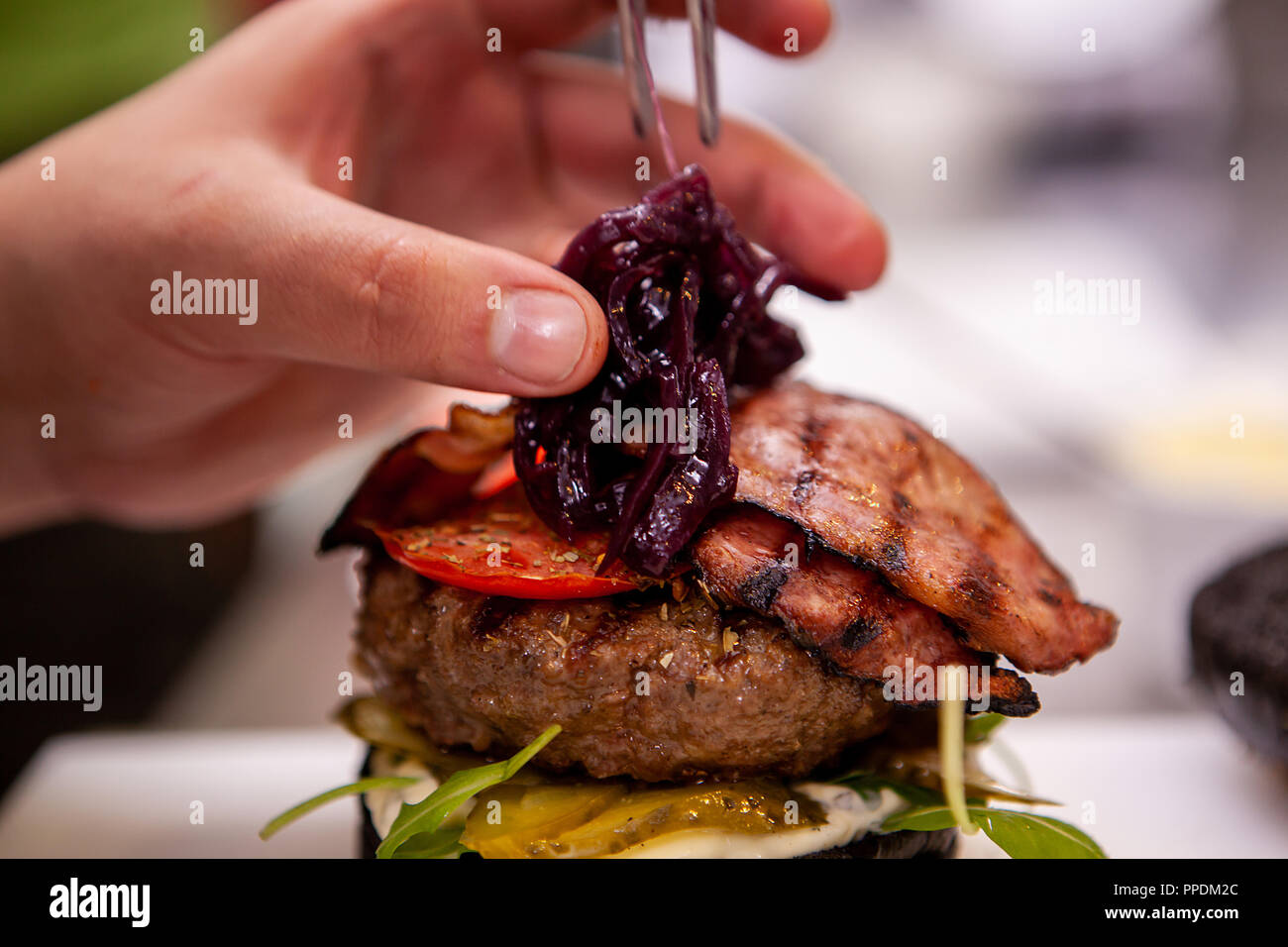 Fine burger dish made by chef cook. In restaurant kitchen Stock Photo ...