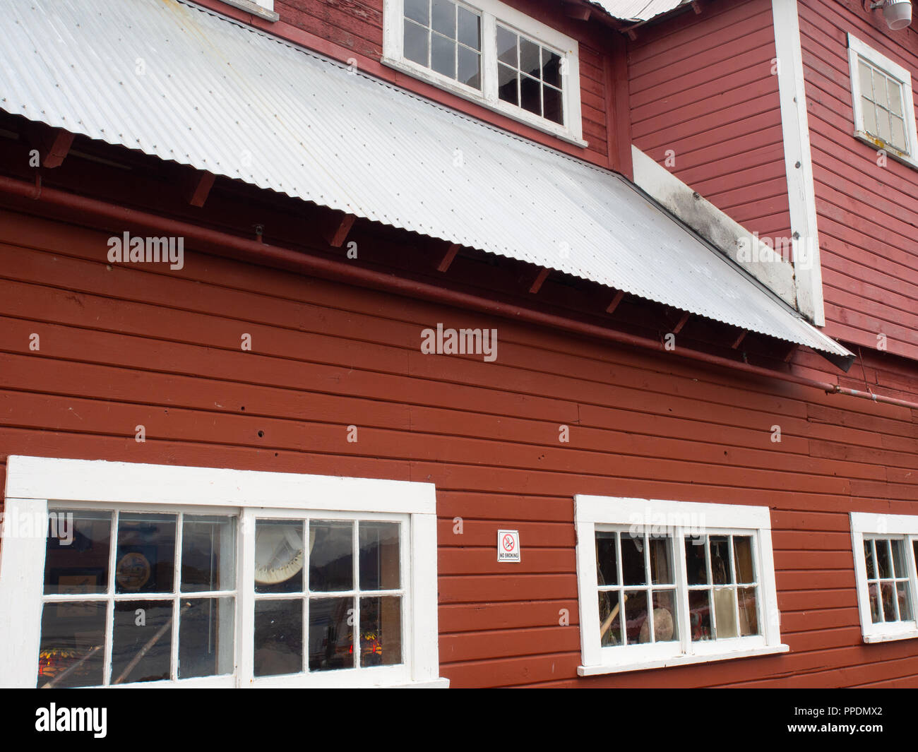 White building red windows hi-res stock photography and images - Alamy