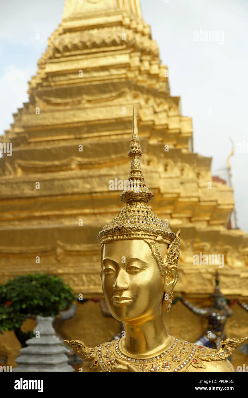 Golden Kinnari statue at Temple of Emerald Buddha (Wat Phra Kaew) in ...