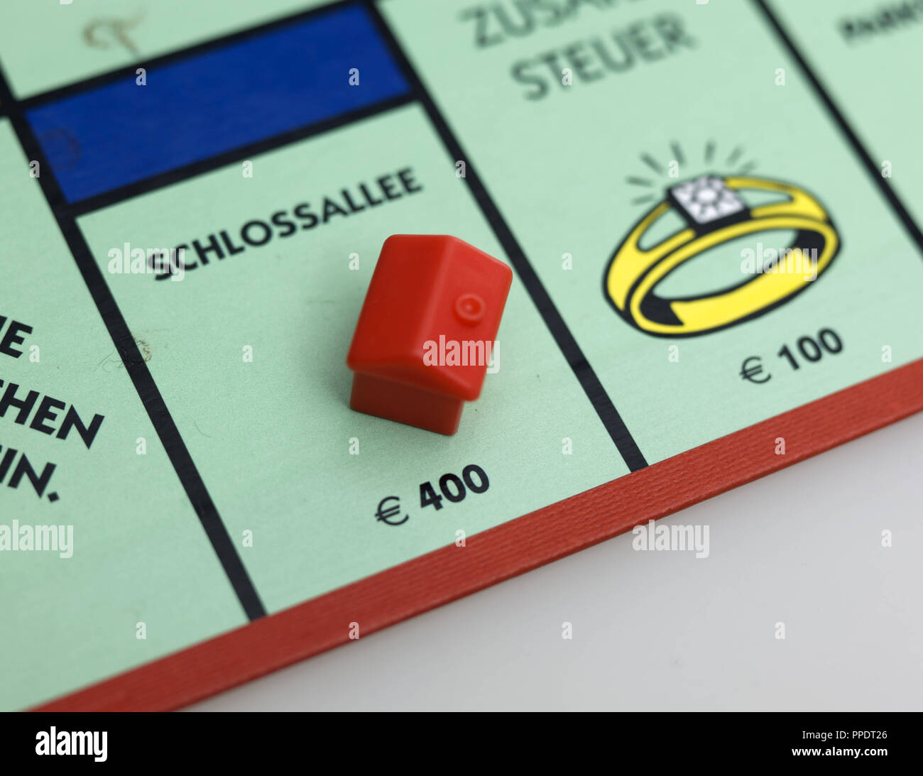 A red house on the boardwalk during a Monopoly game Stock Photo - Alamy