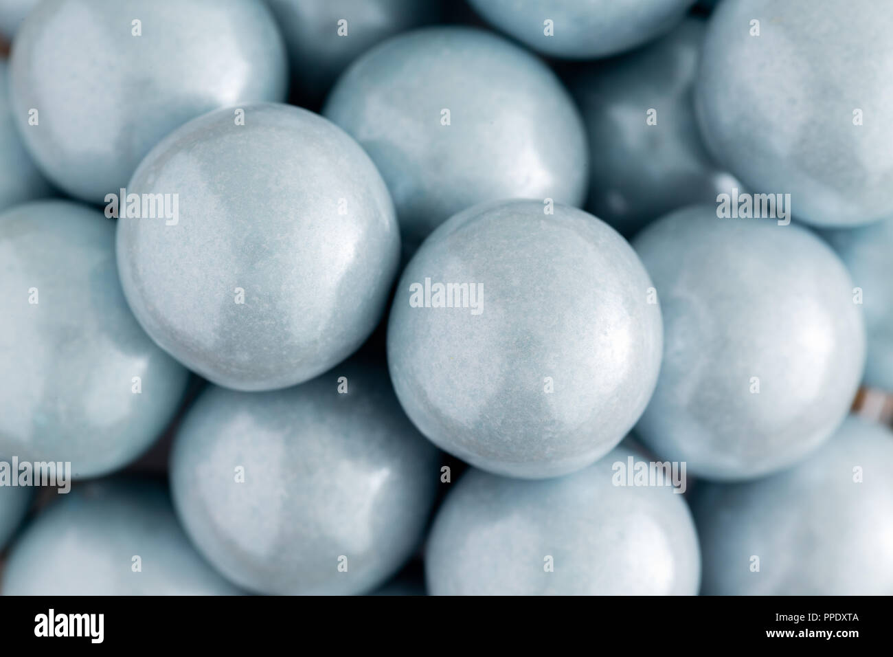 Macro close up of white gumballs, a favorite chewy bubble gum candy ...