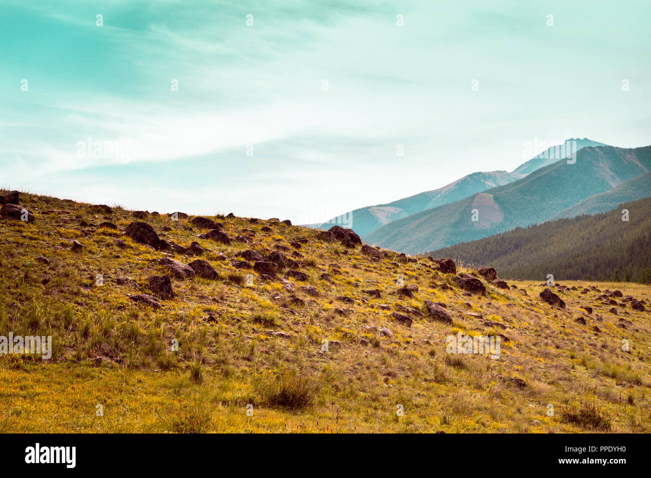 Mountains stones landscape on turquoise sky background Stock Photo - Alamy