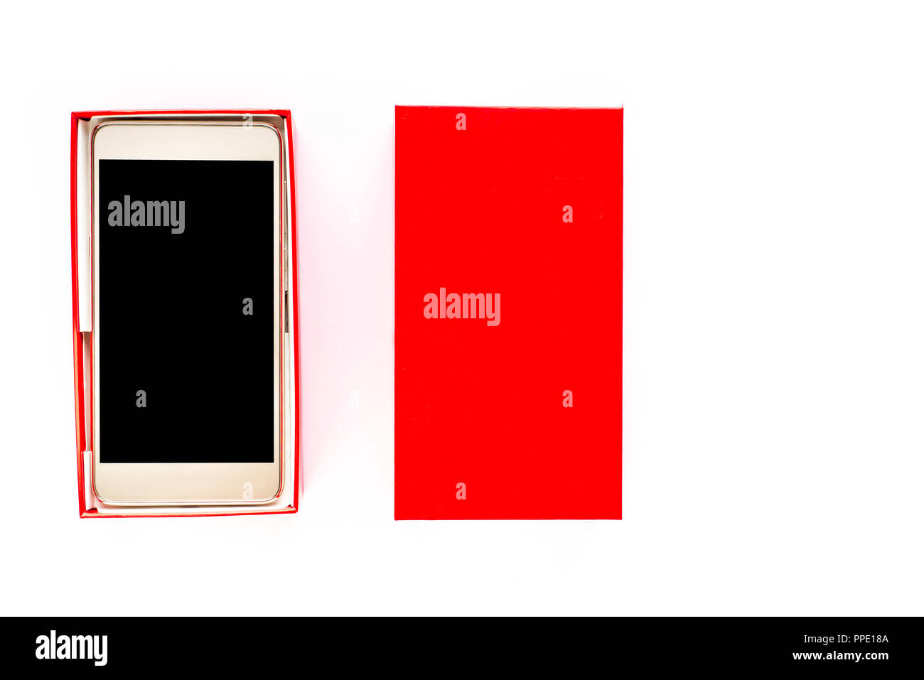 Isolated cell phone, gift box with smartphone with black screen and ...