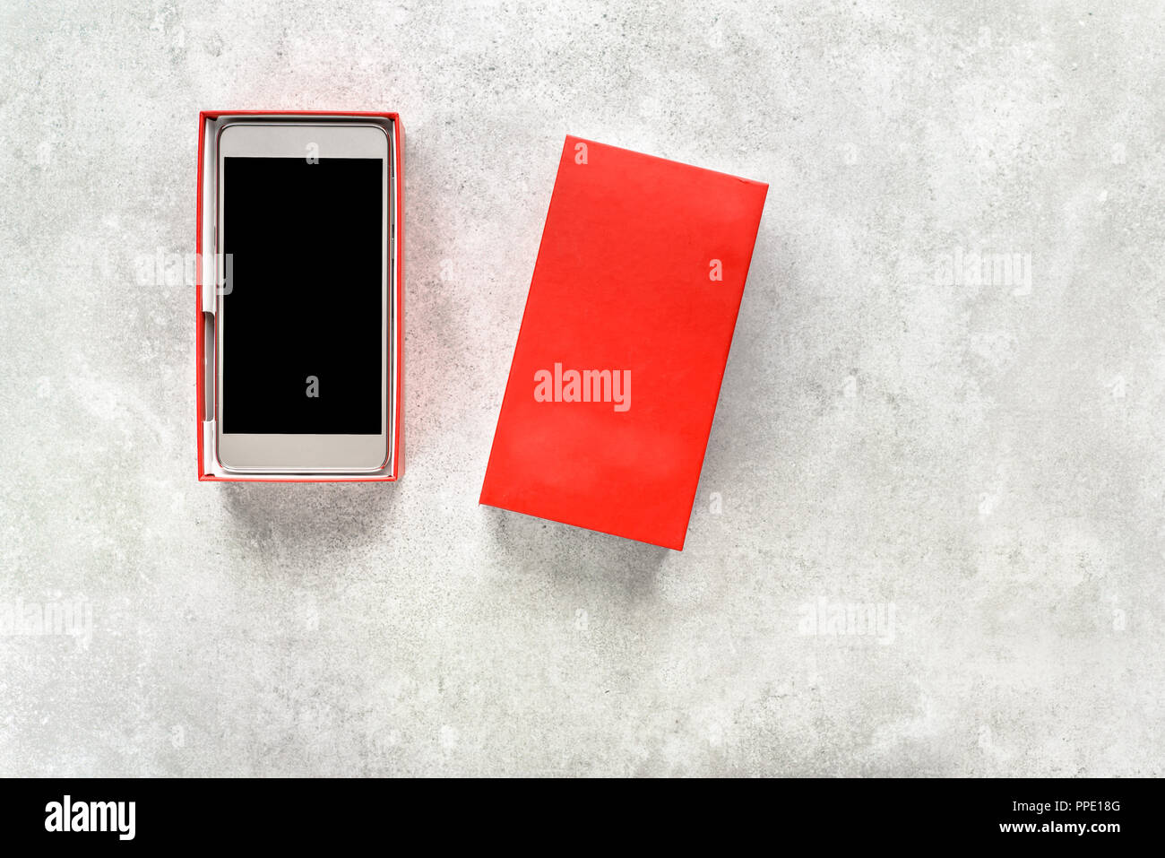 New mobile phone gift box, smartphone with black screen and blank space ...