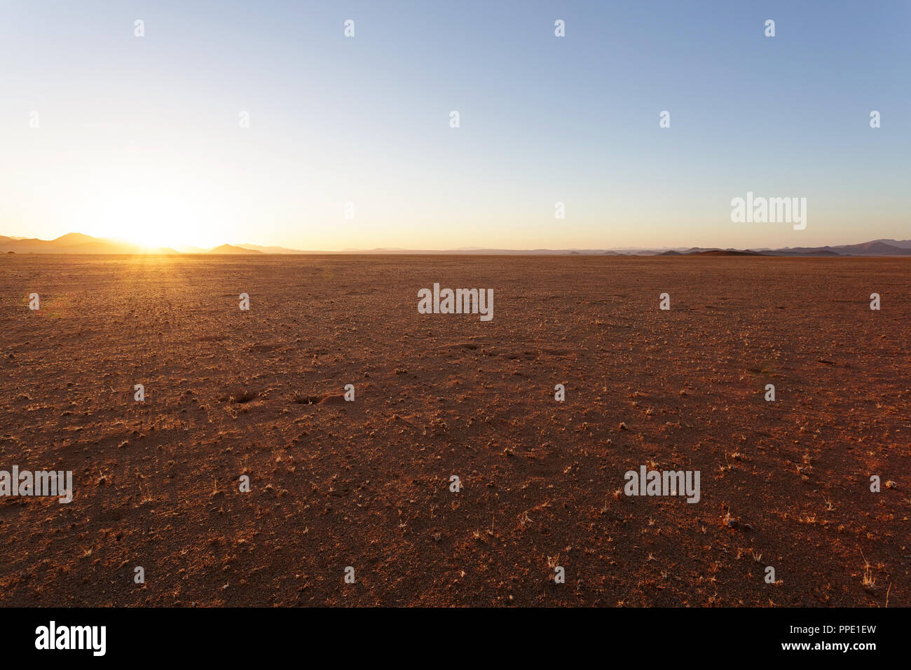 Dry barren landscape in Africa at sunset Stock Photo - Alamy