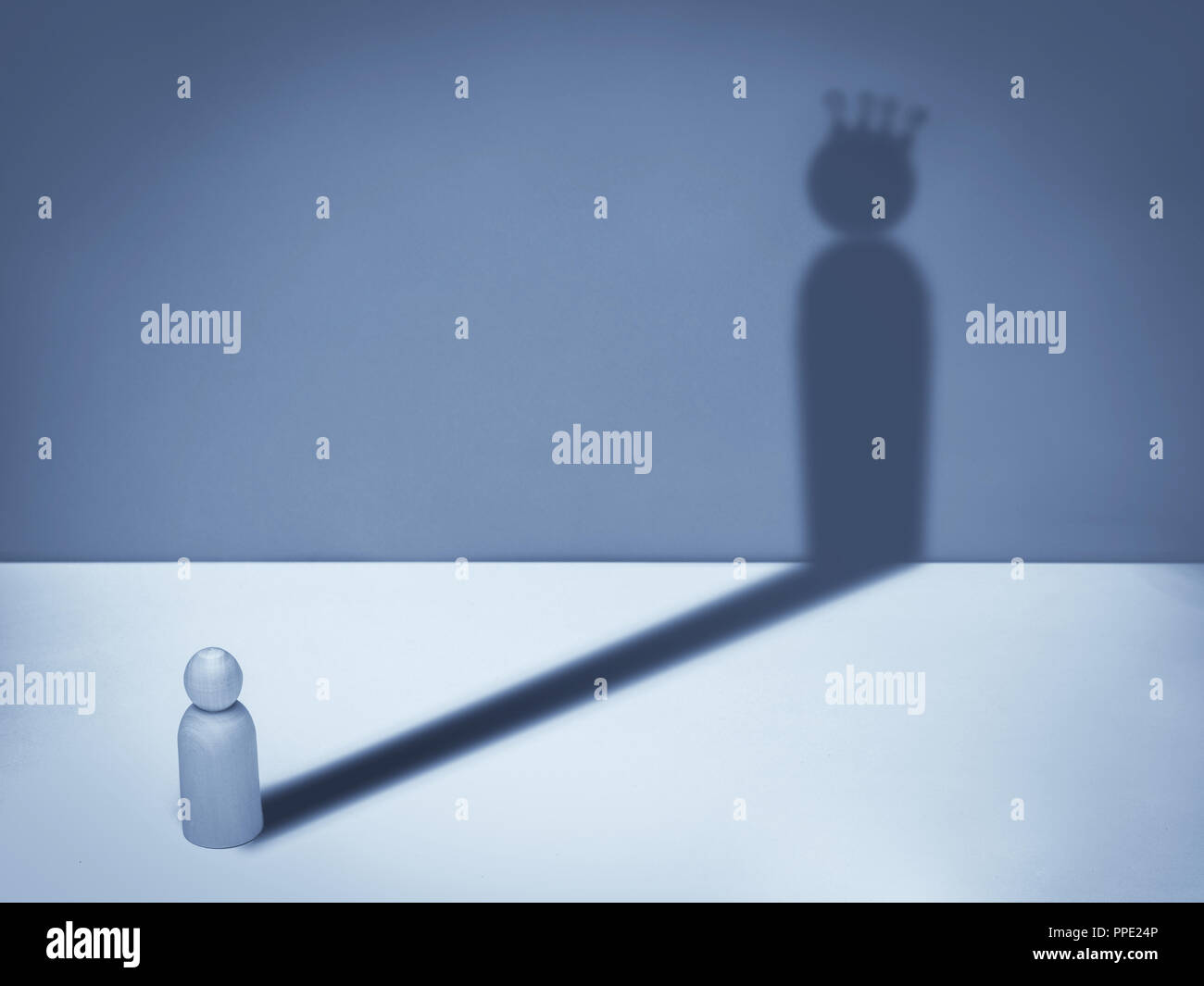 Man with crown shadow. Business symbol of ambition, success, motivation ...