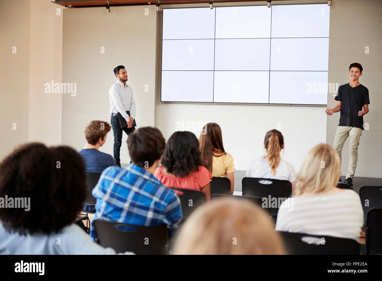 Male Student Giving Presentation To High School Class In Front Of ...