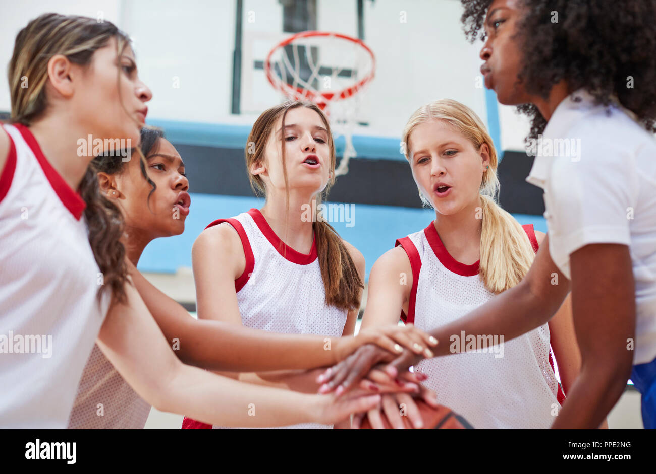Female High School Basketball Players Joining Hands During Team Talk ...