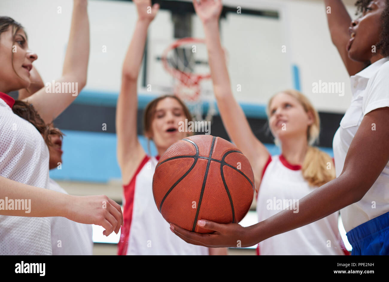 Female High School Basketball Players Joining Hands During Team Talk ...