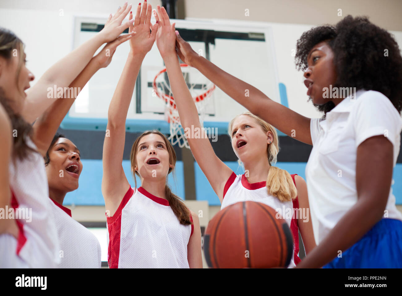 Female High School Basketball Players Joining Hands During Team Talk ...