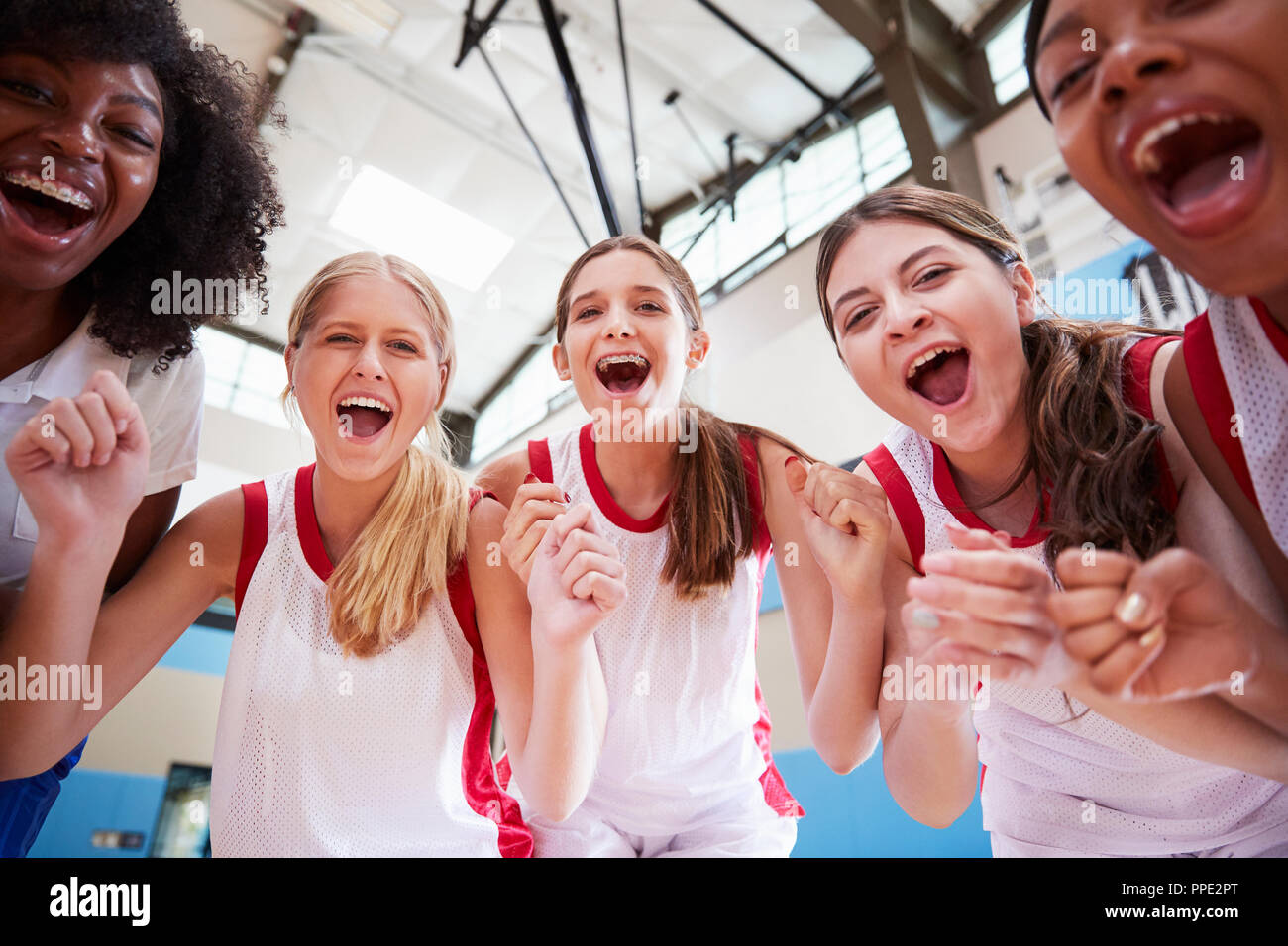 Multi girls team playing basketball hi-res stock photography and images ...