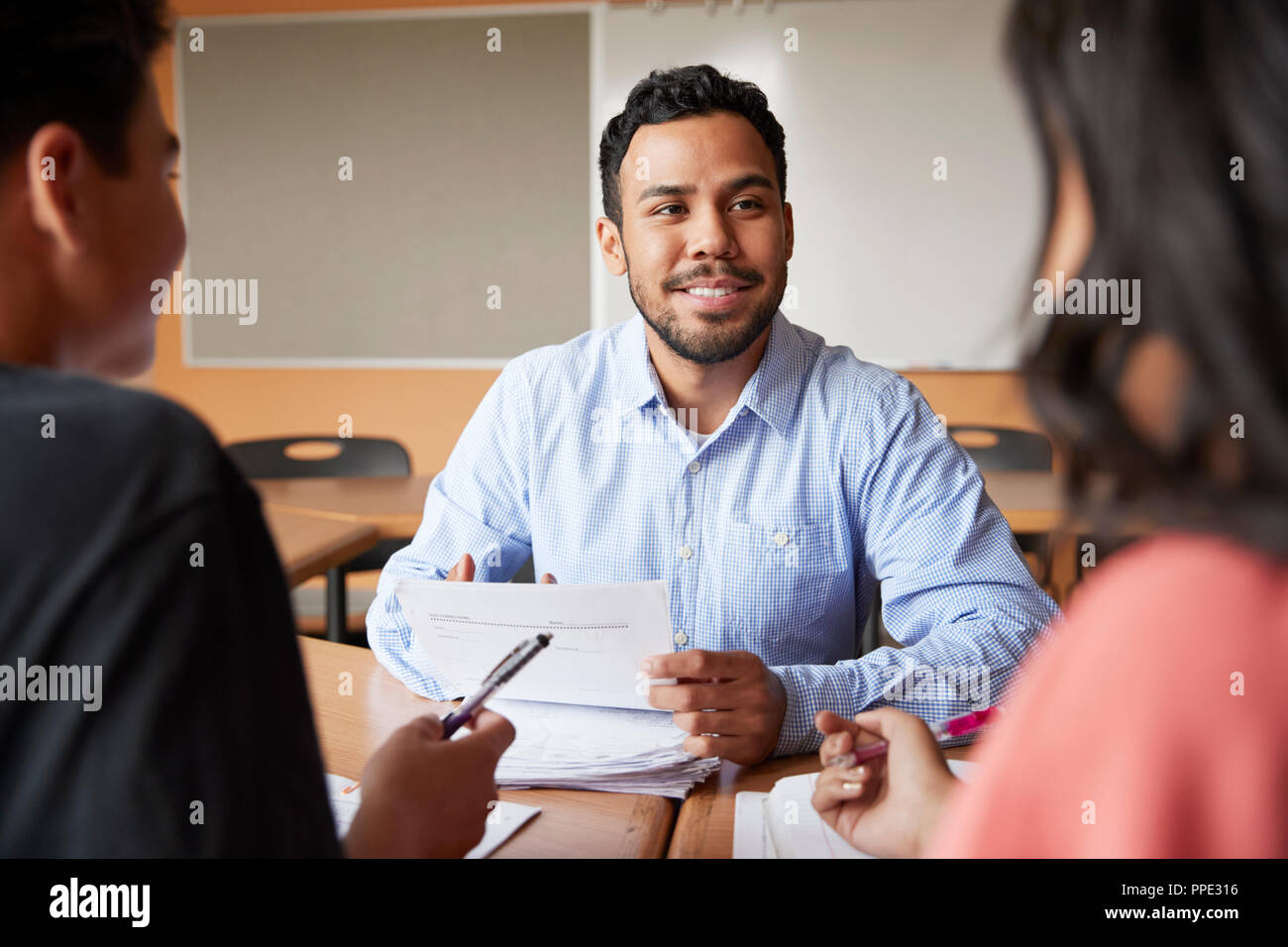 Two students working together classroom hi-res stock photography and ...