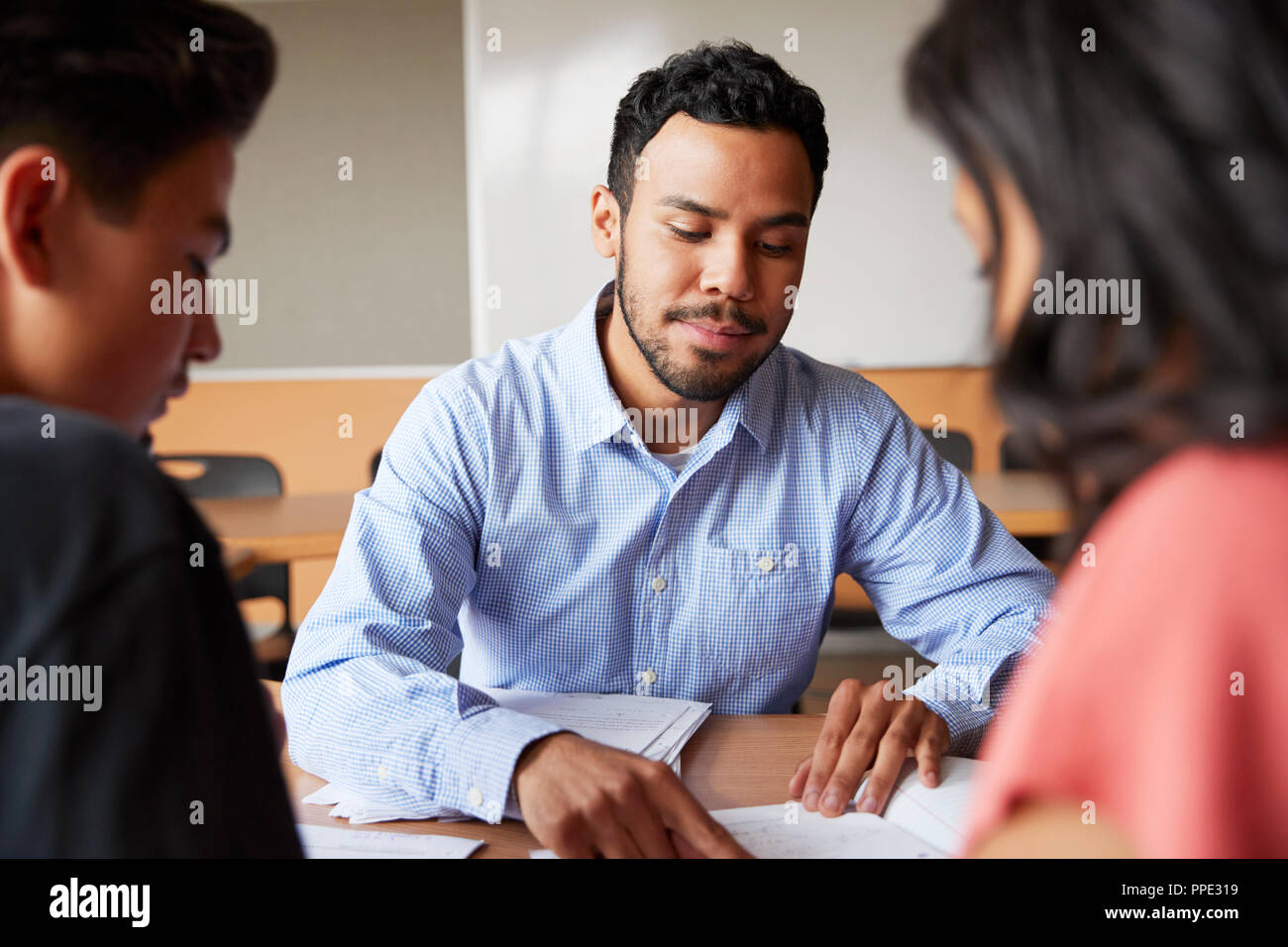 Two students working together classroom hi-res stock photography and ...