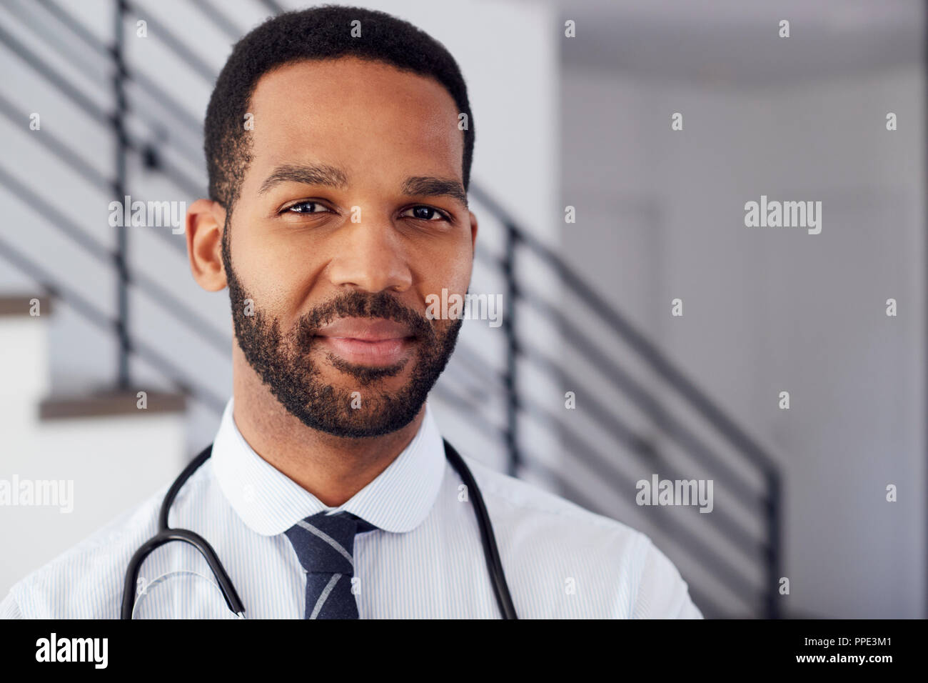 Portrait Of Male Doctor With Stethoscope In Hospital Stock Photo - Alamy