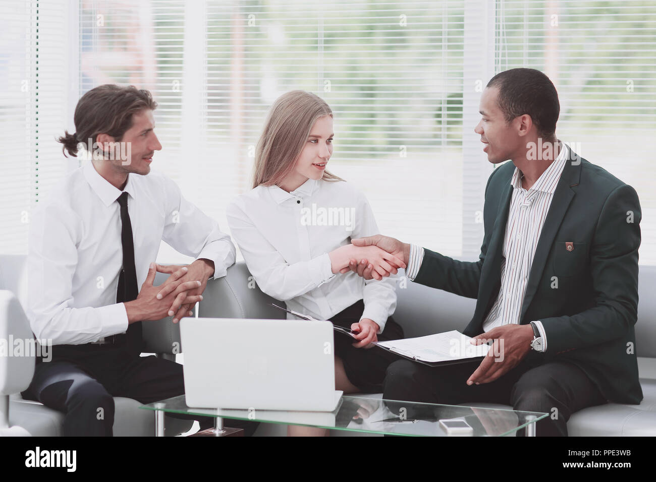 welcome handshake Manager and the client.photo with copy space Stock ...
